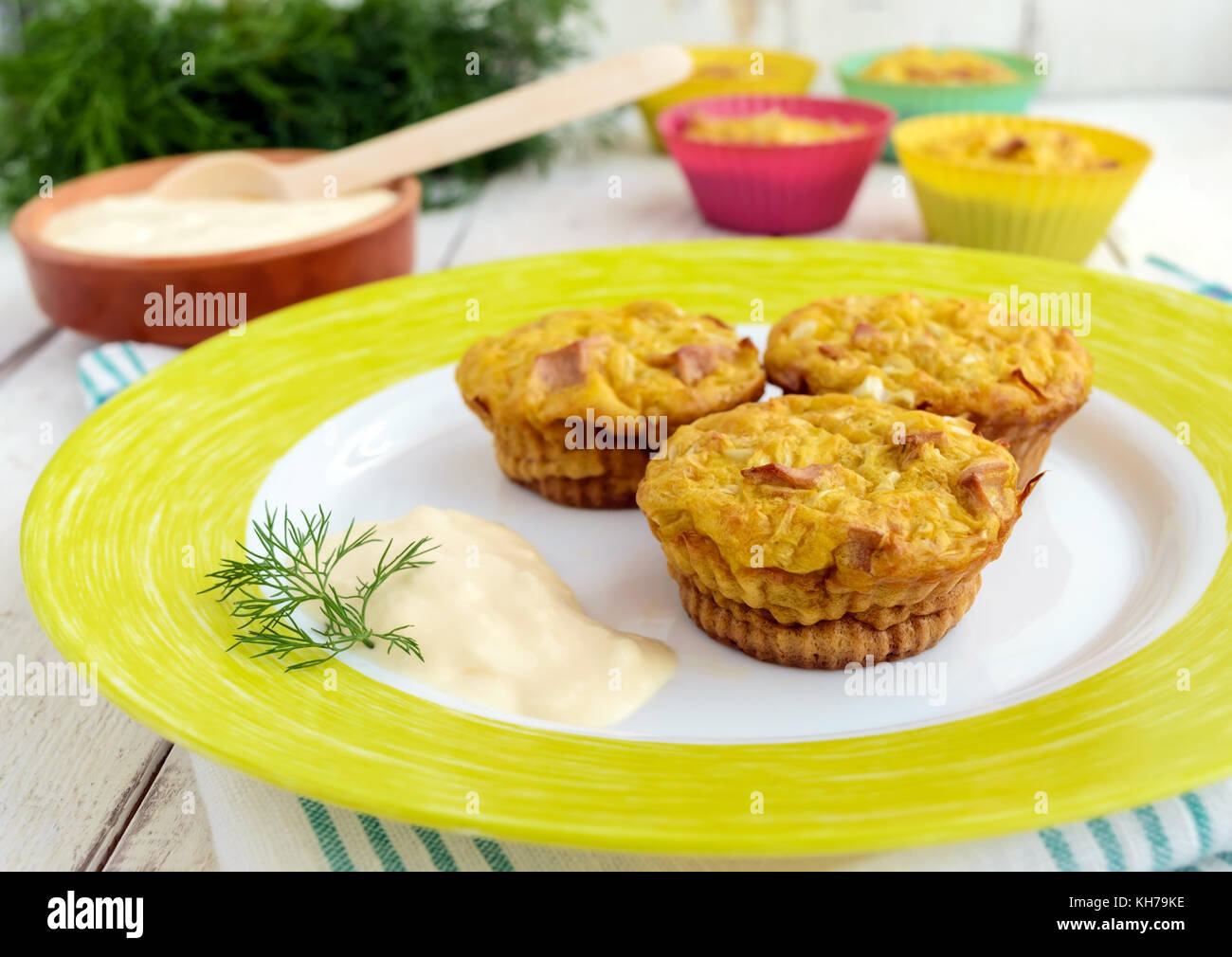 Muffins from cabbage with ham and cheese. Sour cream sauce Stock Photo ...