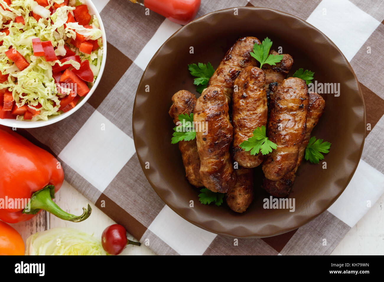 Juicy grilled rolls of minced meat wrapped in bacon. The top view Stock ...