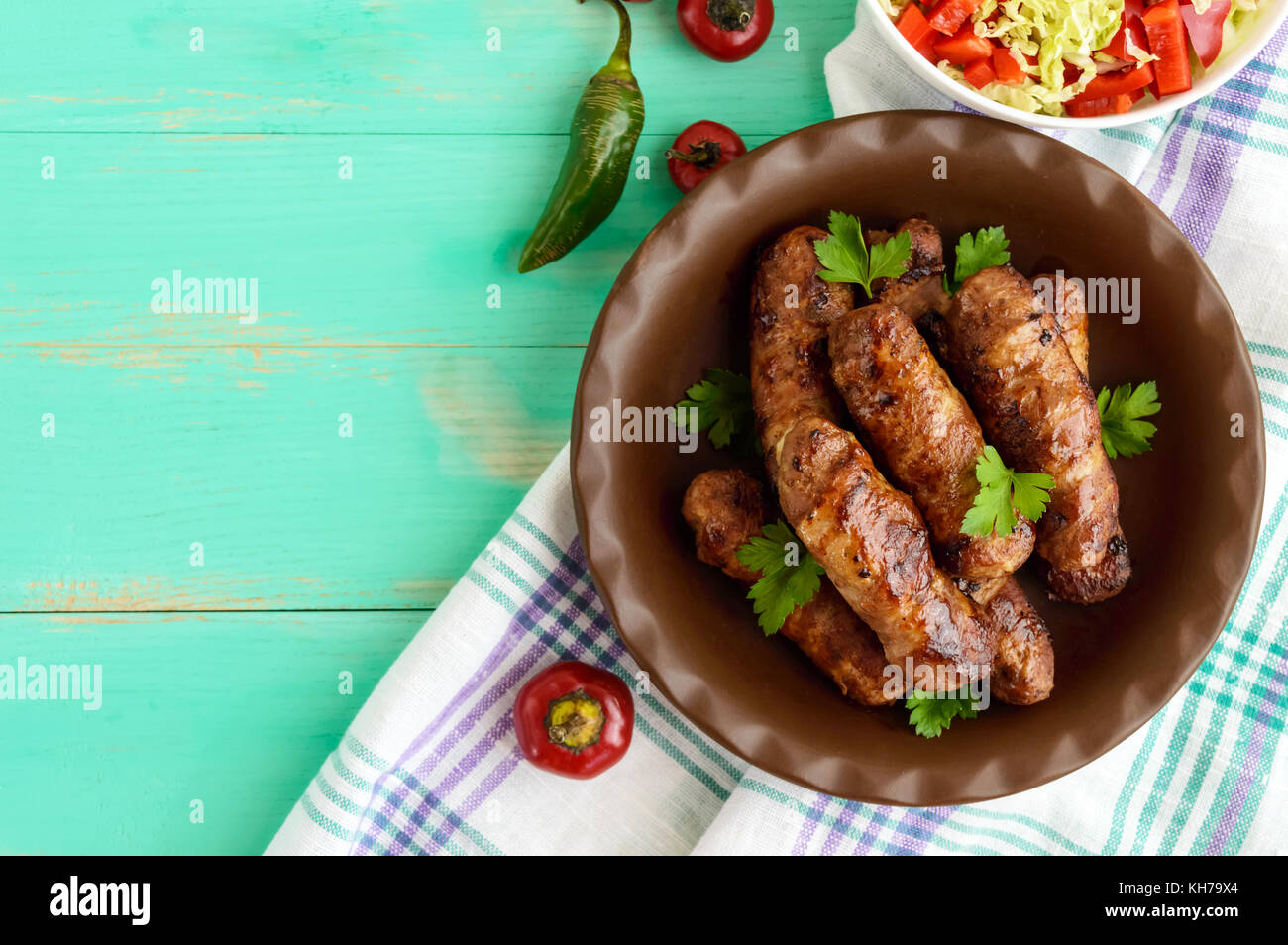 Juicy grilled rolls of minced meat wrapped in bacon. The top view Stock ...
