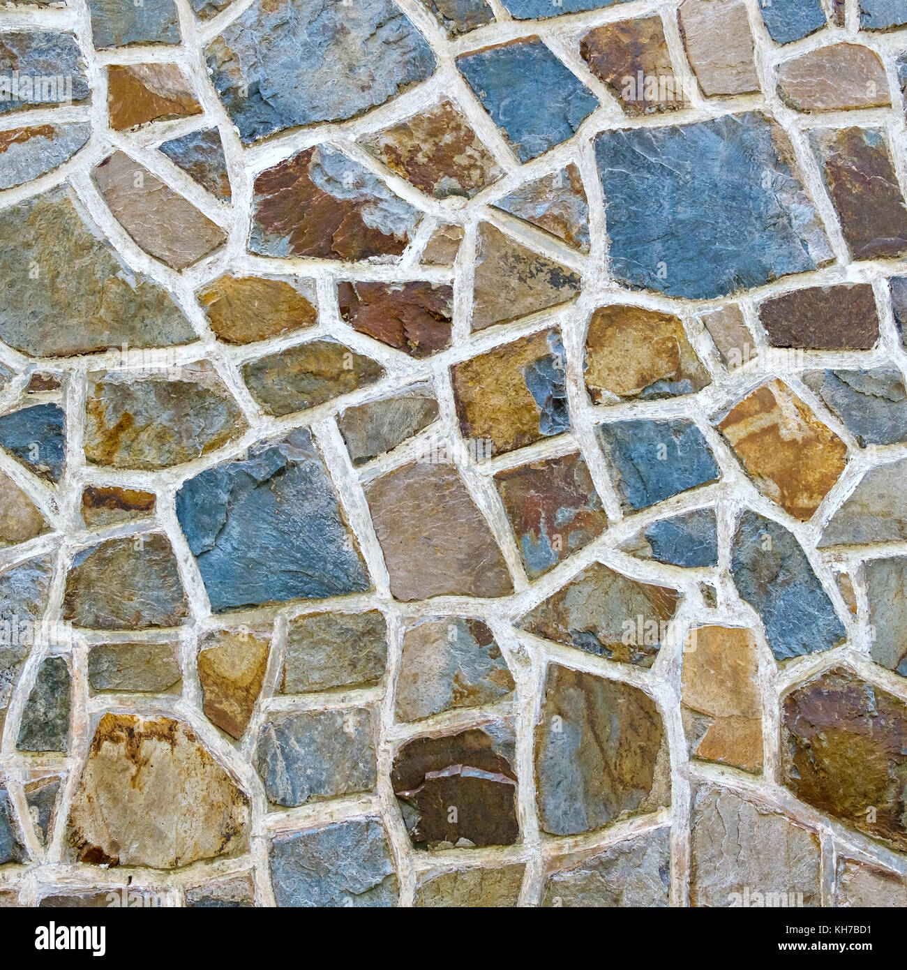 Colorful stone wall texture background Stock Photo - Alamy