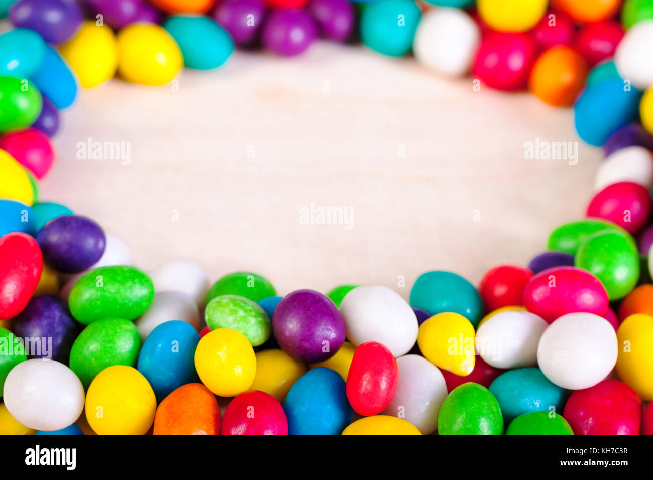 frame from of a circle colorful sweets of sugar candies. background ...