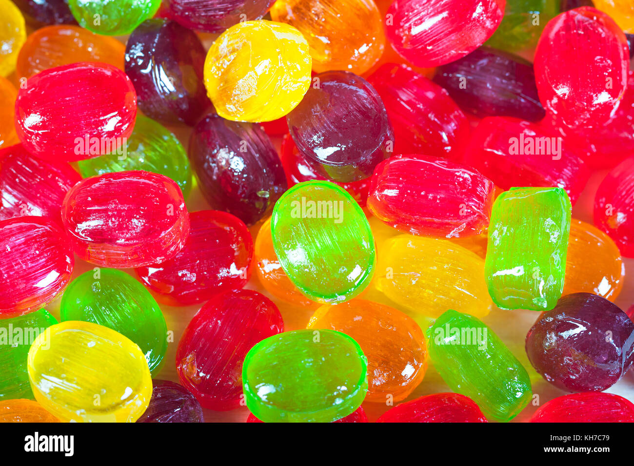 background from colorful sweets of sugar candies. colored sweets close ...