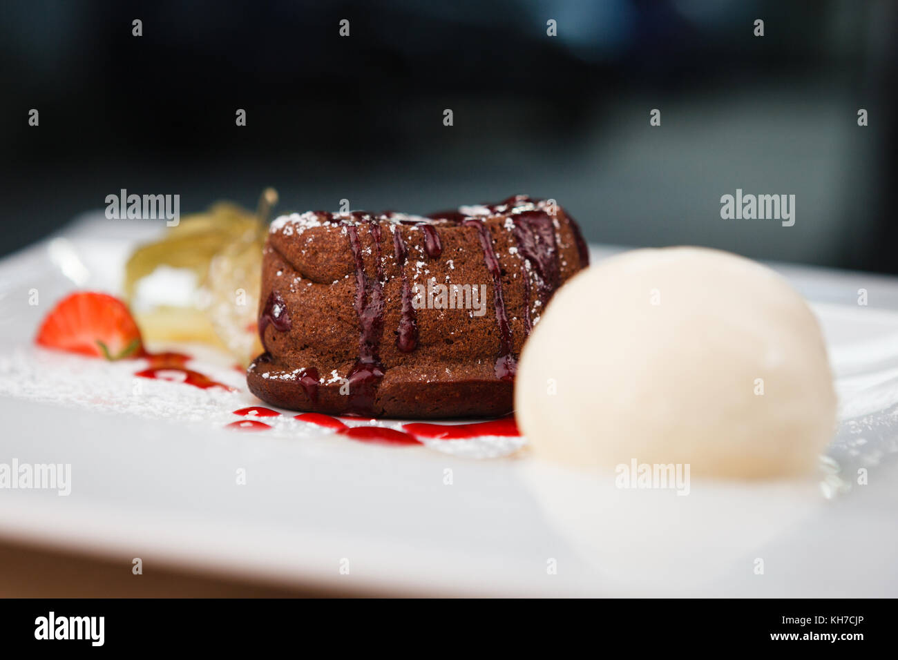 Chocolate fondant with vanilla ice cream and raspberry sauce Stock ...