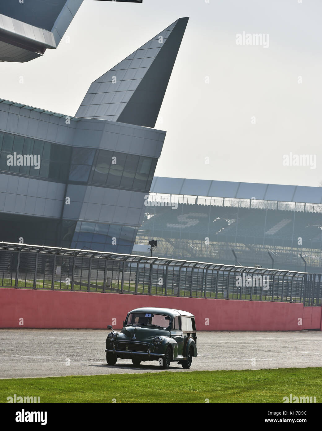Peter Deffee, Morris Minor Traveller, races past the Wing building ...