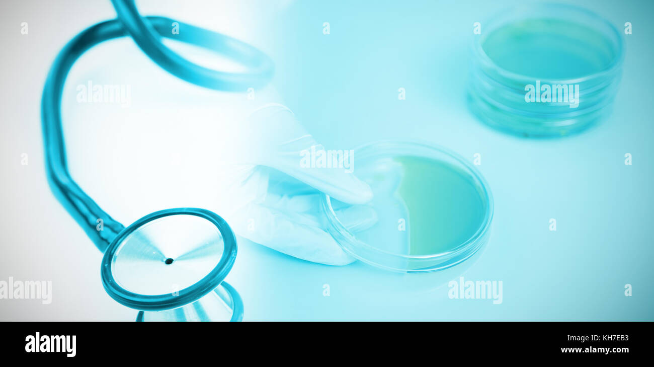 Blue stethoscope against doctor experimenting in laboratory Stock Photo ...
