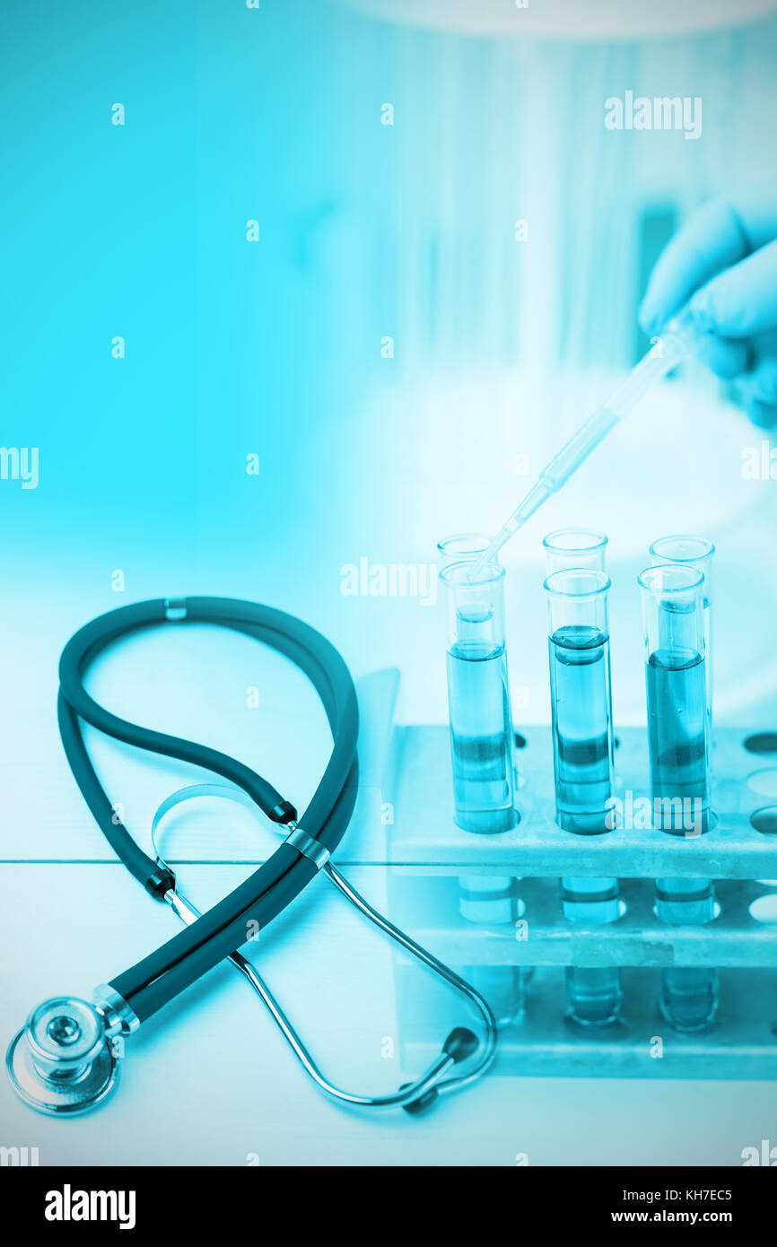 Stethoscope on desk against doctor experimenting in laboratory Stock ...