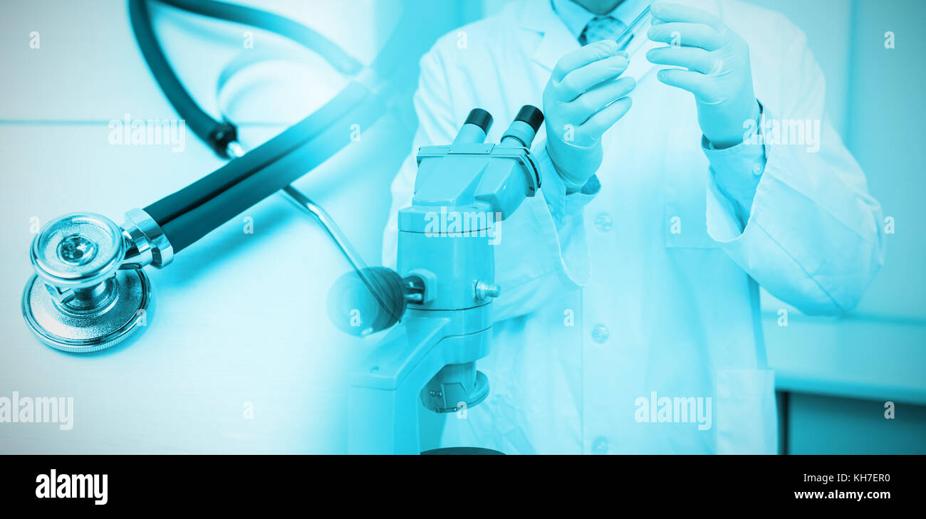 Stethoscope on desk against doctor experimenting in laboratory Stock ...