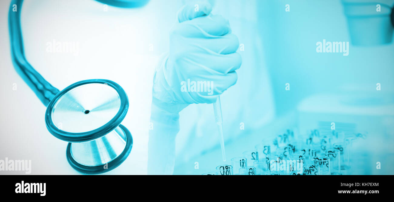 Blue stethoscope against doctor experimenting in laboratory Stock Photo ...