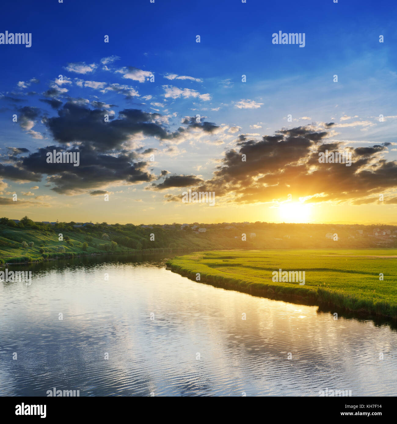 sunset over river Stock Photo - Alamy