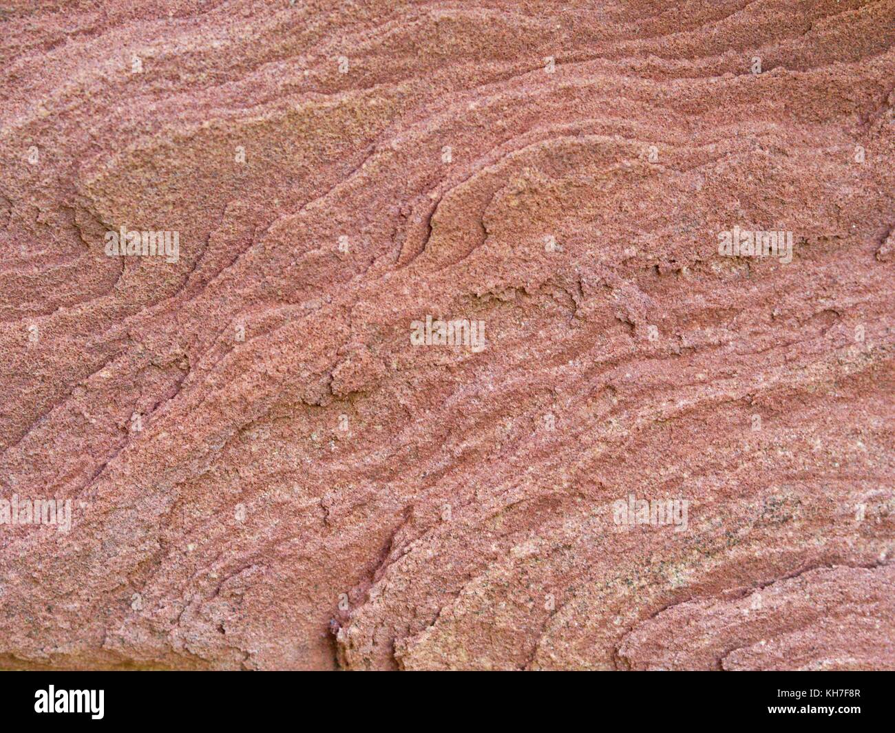 Texture of a reddish rock Stock Photo - Alamy