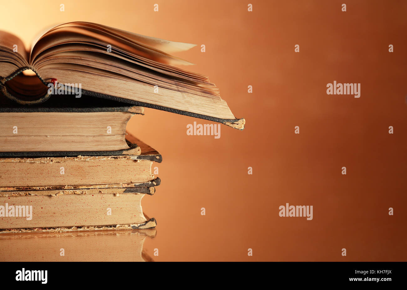 Stack of very old books on nice gradient background with reverberation ...