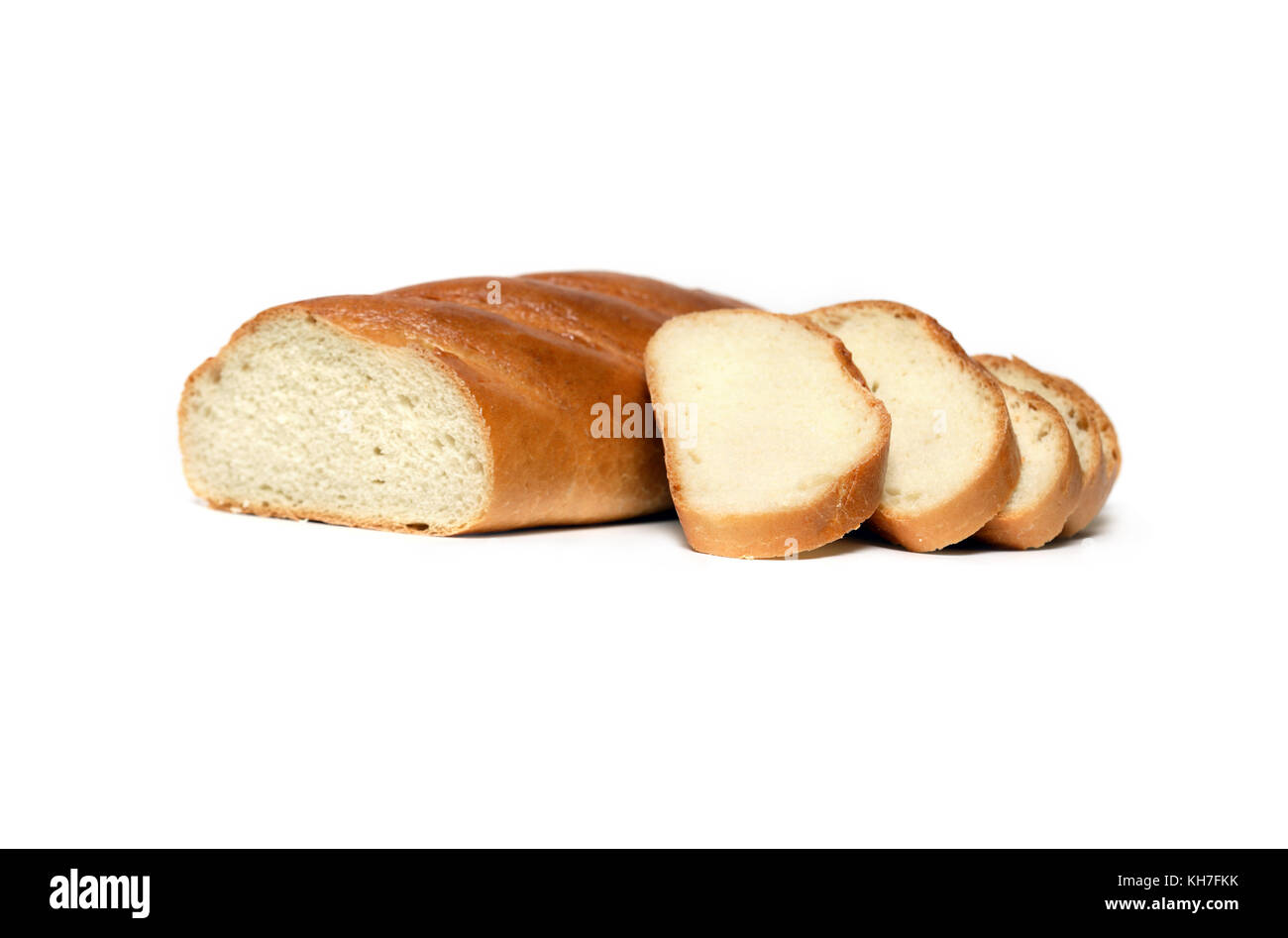 Sliced fresh-baked long loaf of bread isolated on white background ...