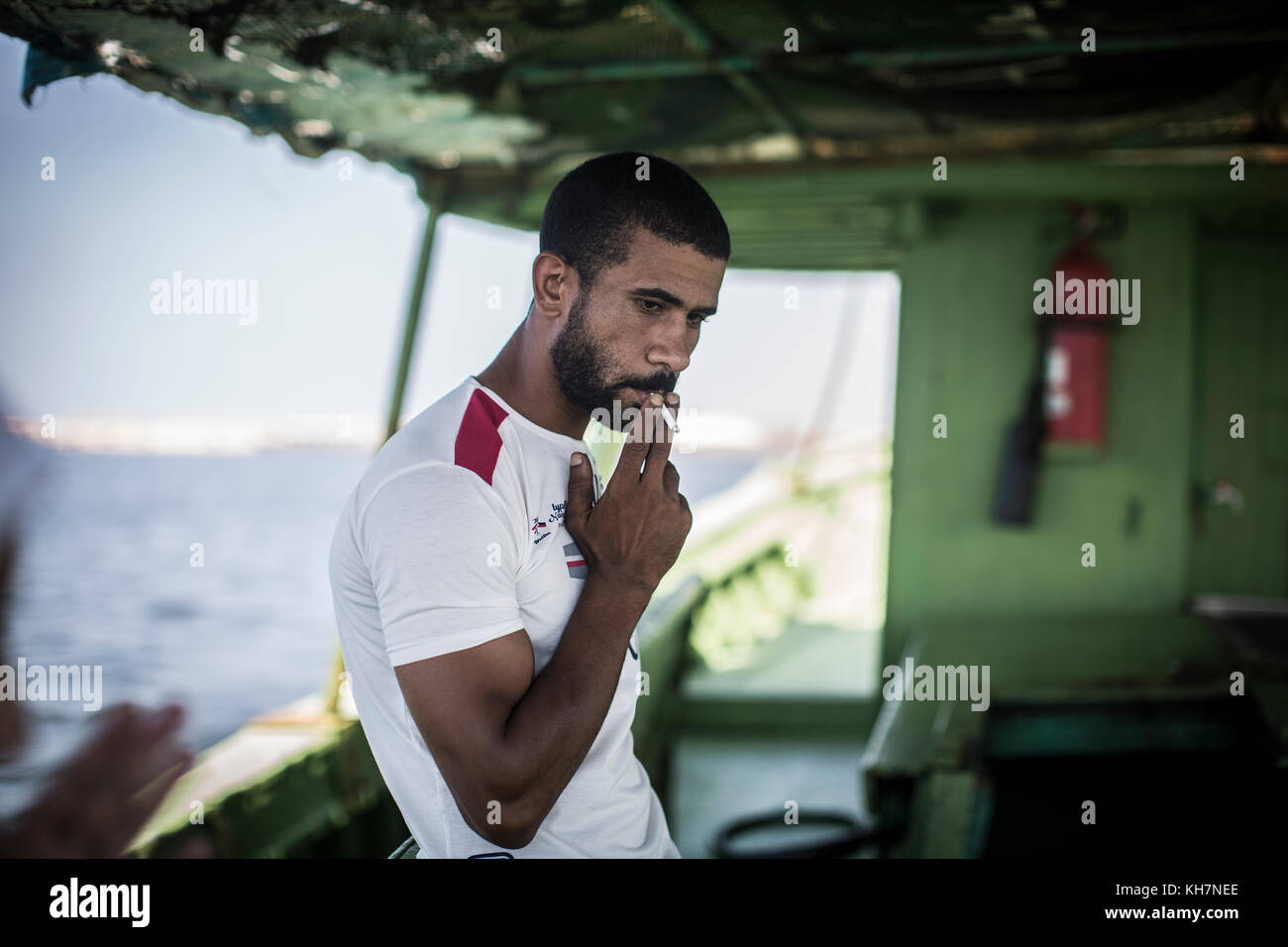 Fisherman Karam standing aboard his boat in the Mediterranean sea off ...