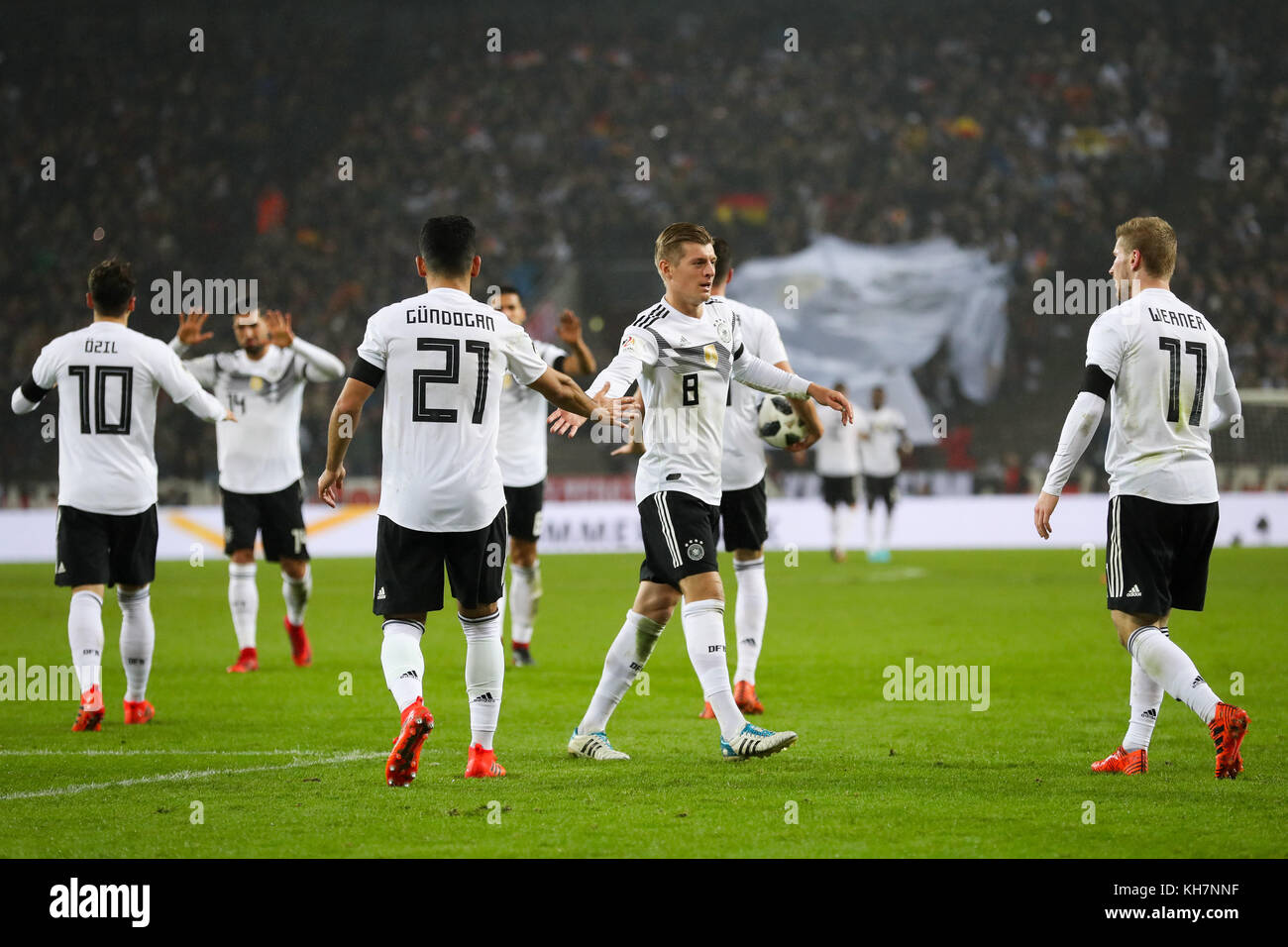 Cologne, Germany. 14th Nov, 2017. German players (left to right) Mesut ...