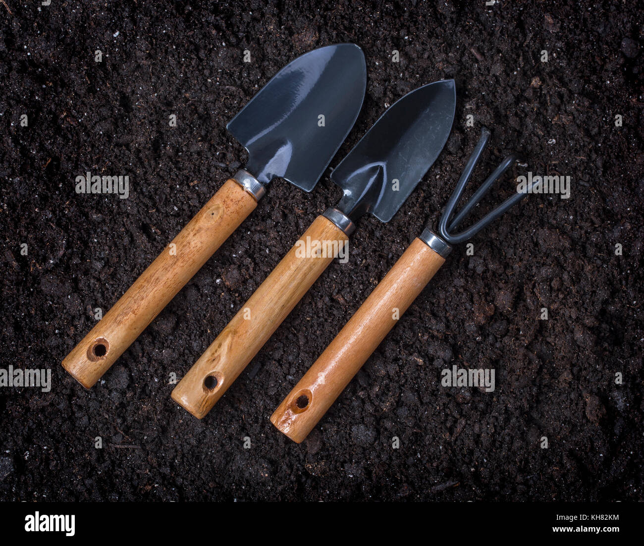Close-up of the organic soil and spade Stock Photo - Alamy