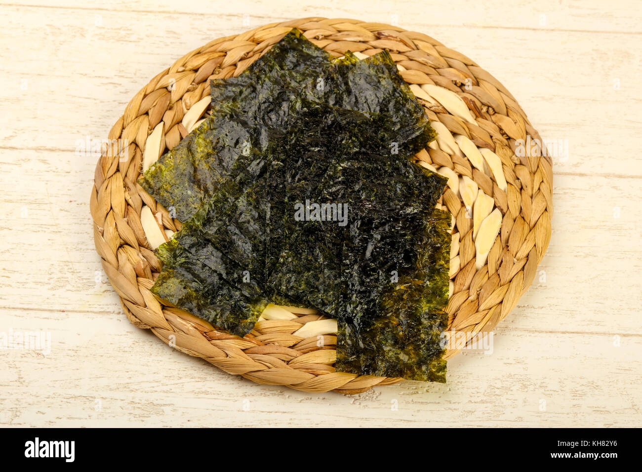 Crispy Nori sheets chips over wooden background Stock Photo - Alamy