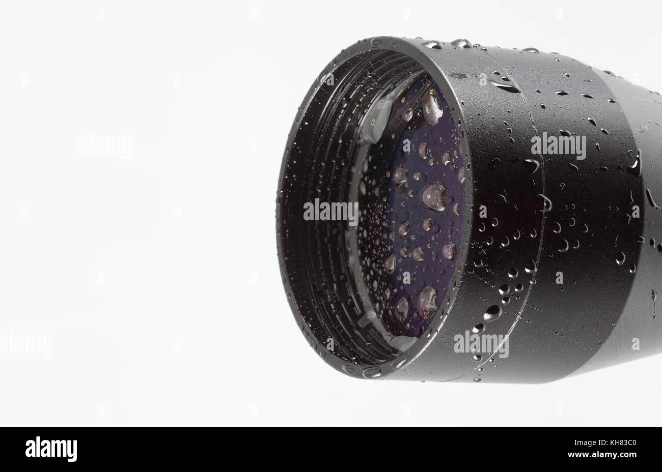 Objective lens of a rifle scope covered in water drops Stock Photo - Alamy