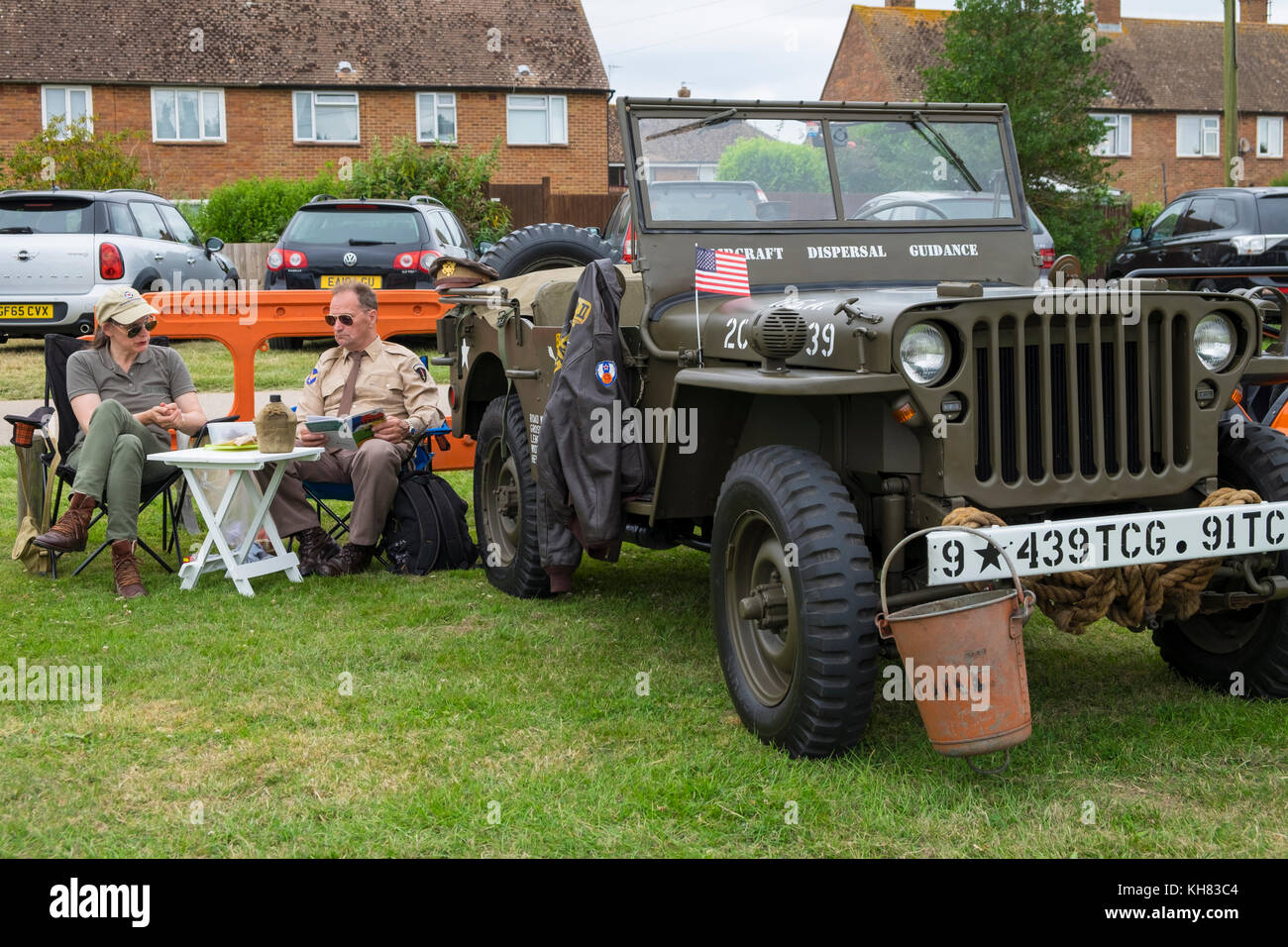 A World War II, WWII, Willys Jeep on display in a field, with the ...