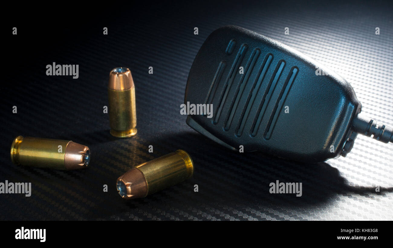 Police microphone with hollow point handgun ammunition Stock Photo - Alamy