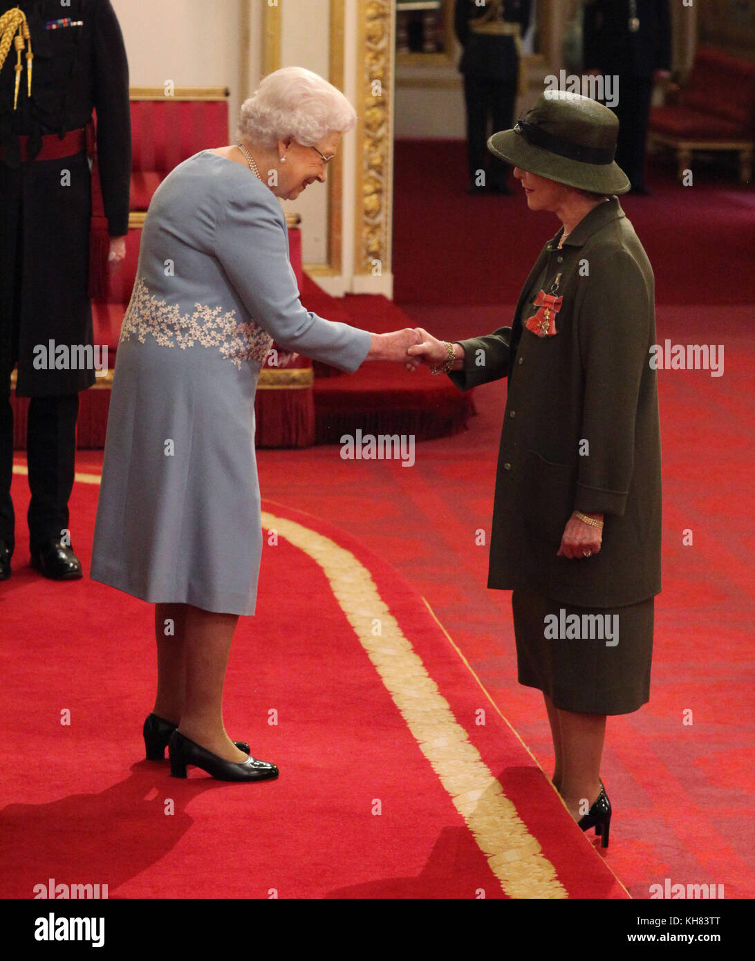 Is made an obe by the queen at buckingham palace hi-res stock ...
