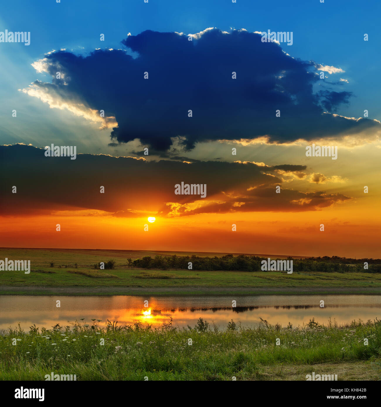 dramatic sunset over river Stock Photo - Alamy