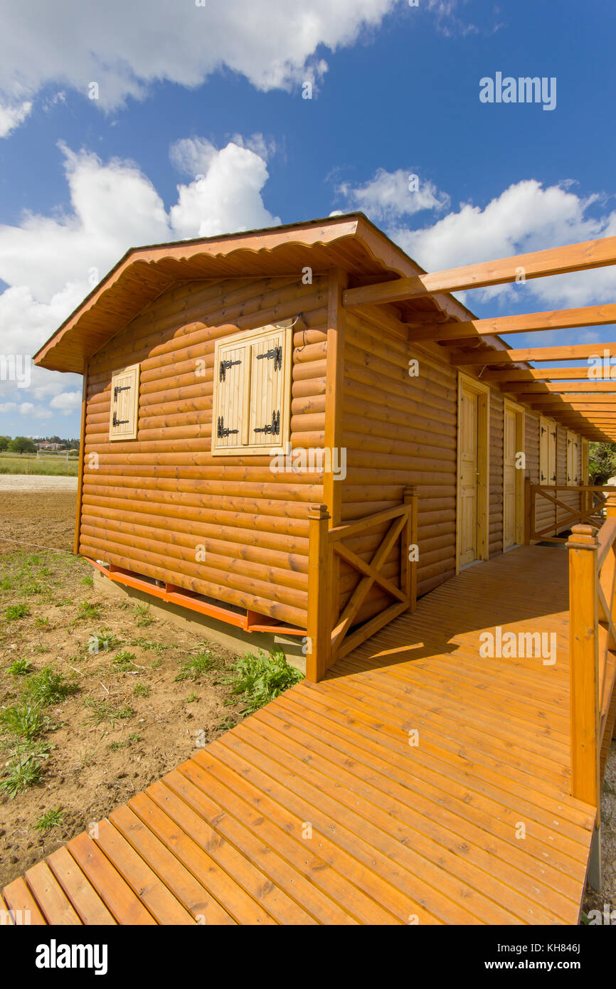 wooden small house in a field Stock Photo - Alamy