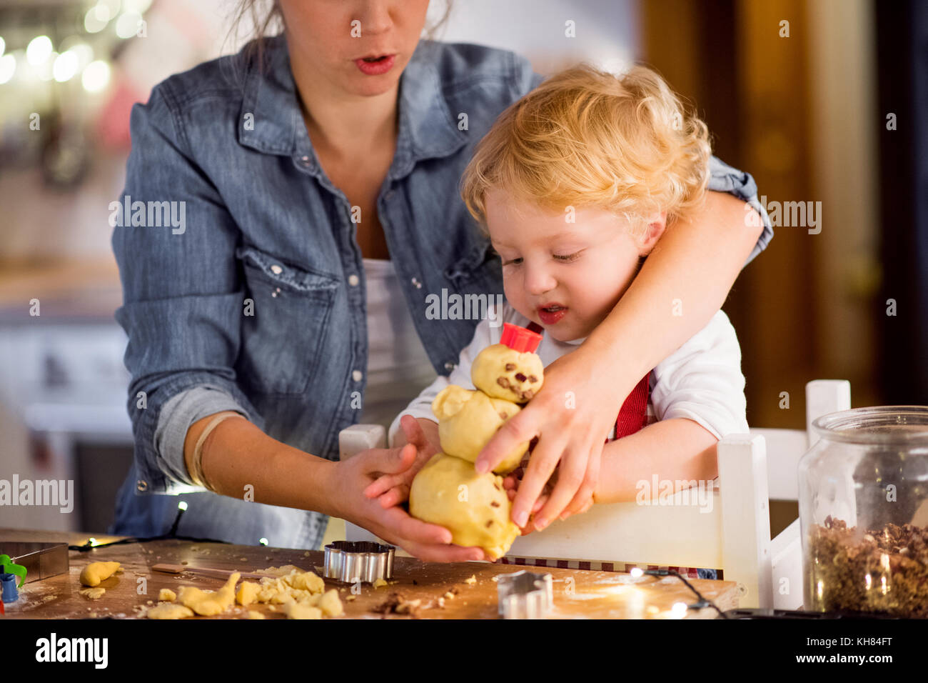 Young family making cookies at home Stock Photo - Alamy