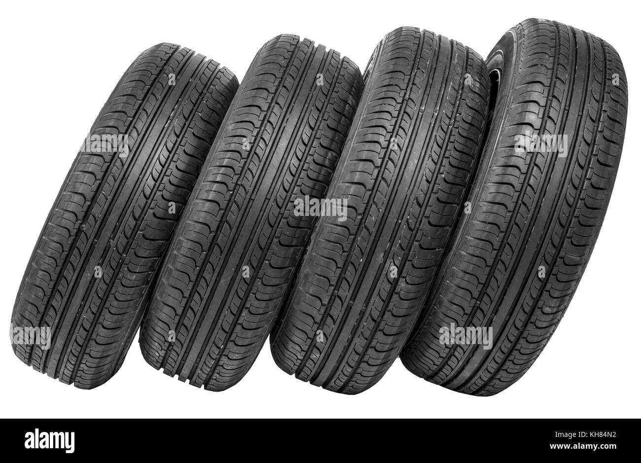 Stack of four wheel new black tyres Stock Photo - Alamy