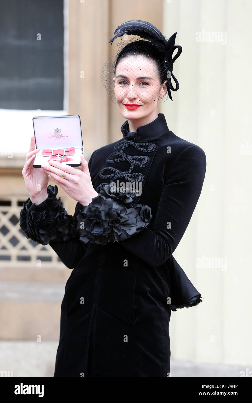 Erin O'Connor after she was awarded an MBE by Queen Elizabeth II at an ...