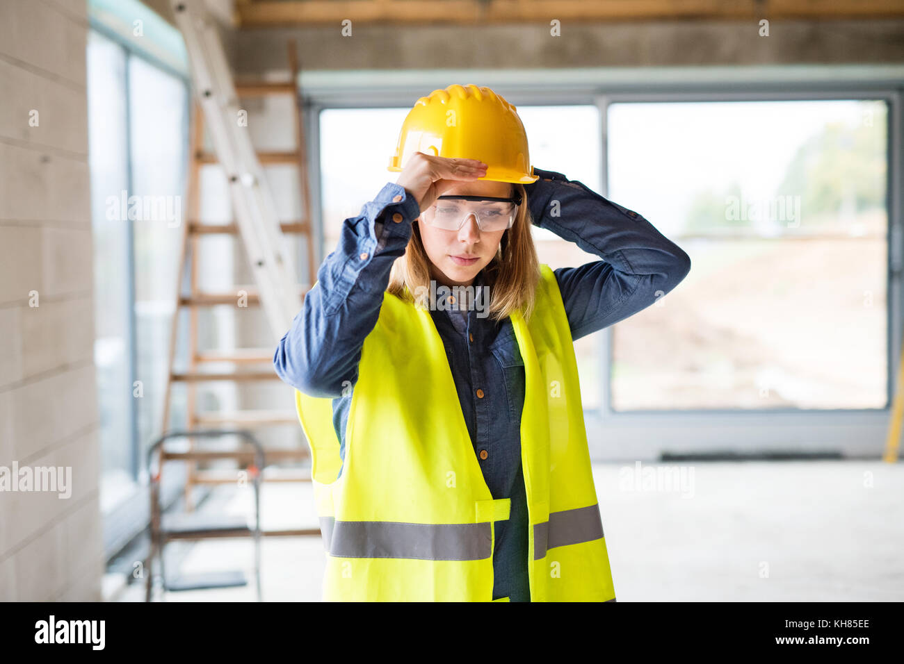 Young woman worker on the construction site Stock Photo - Alamy