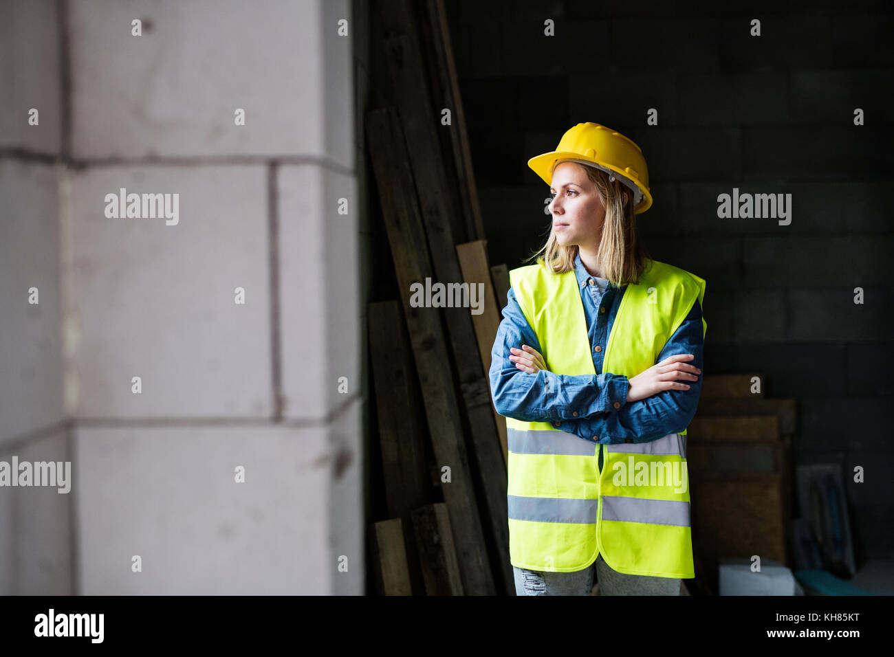 Young woman worker on the construction site Stock Photo - Alamy
