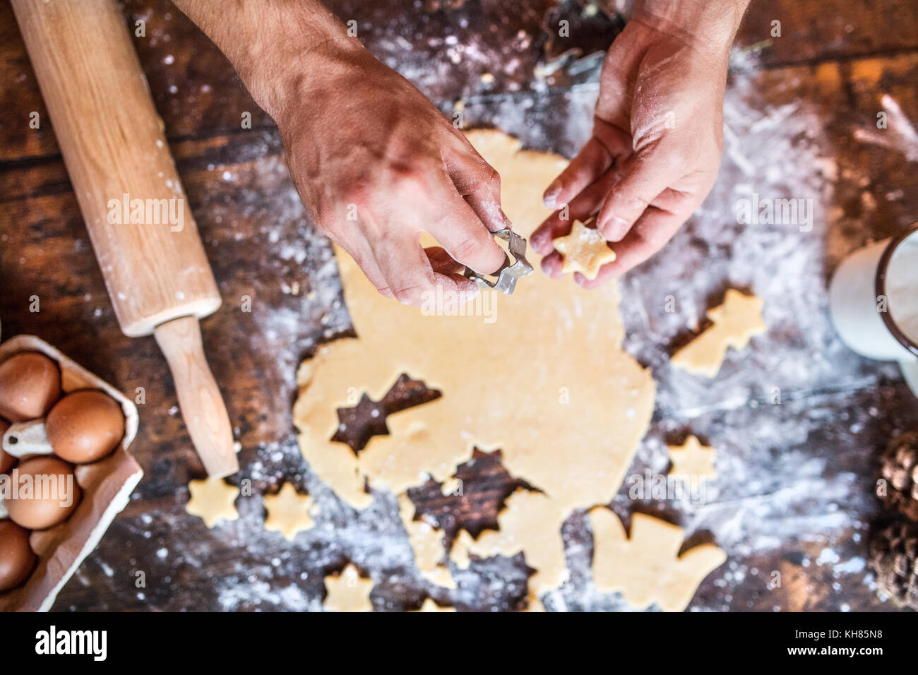 Baking gingerbread cookies at Christmas time Stock Photo - Alamy