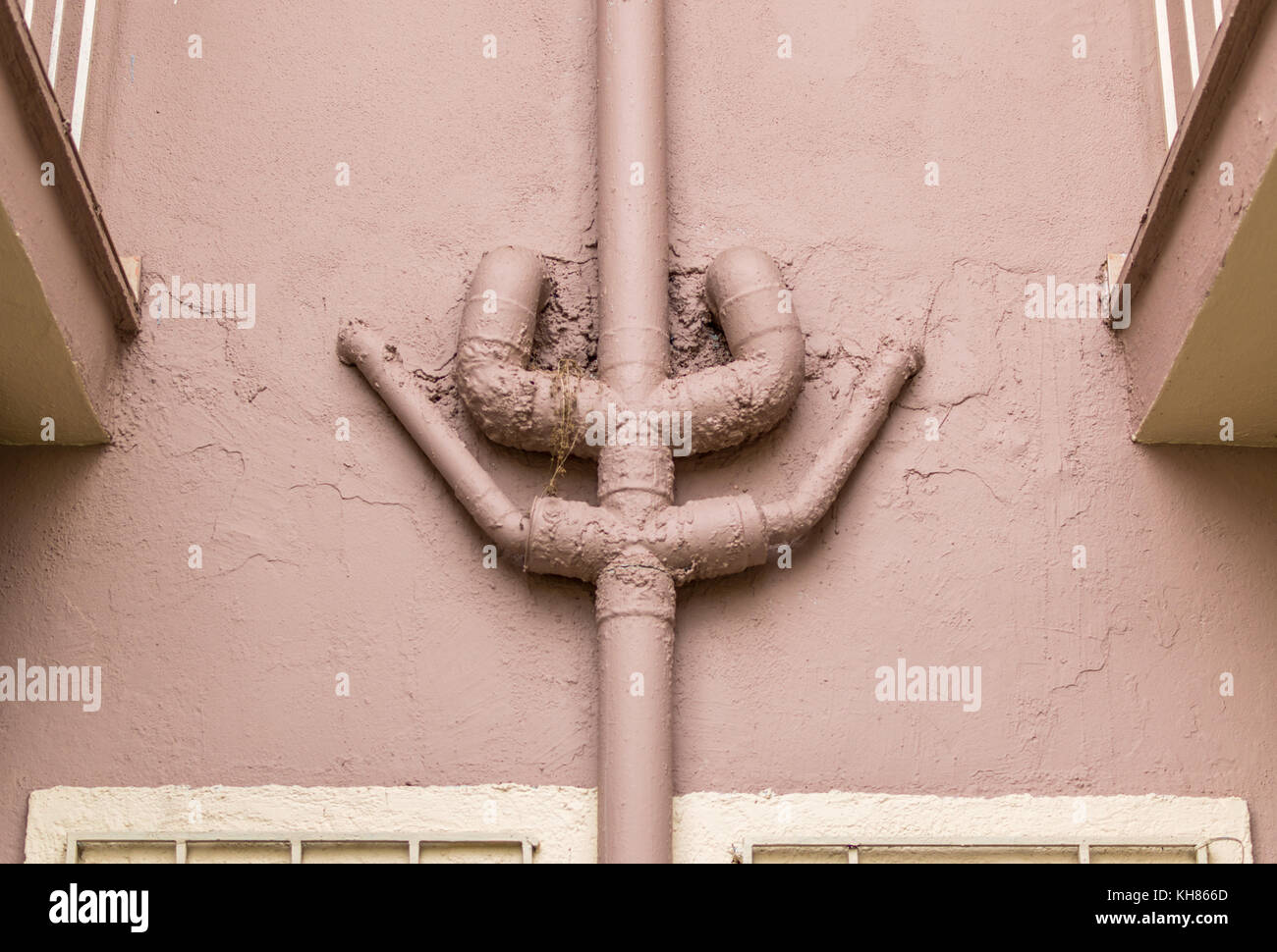 Funny sewage and drain pipes coming out from a building Stock Photo - Alamy