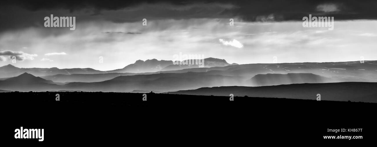Monochrome sunset over mountains. Fantastic panorama view of misty ...