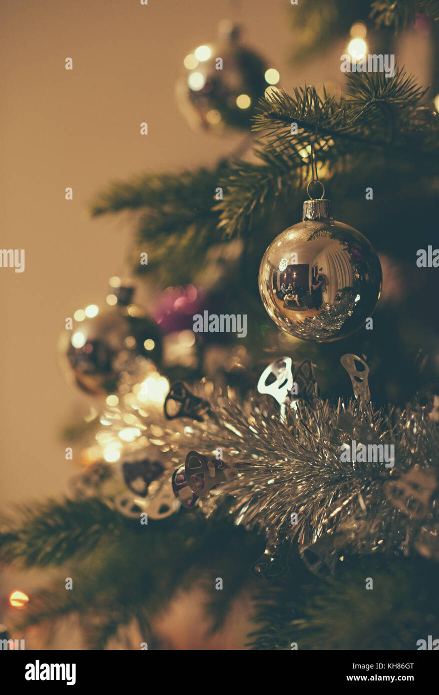 Vintage christmas tree with silver decorations Stock Photo - Alamy