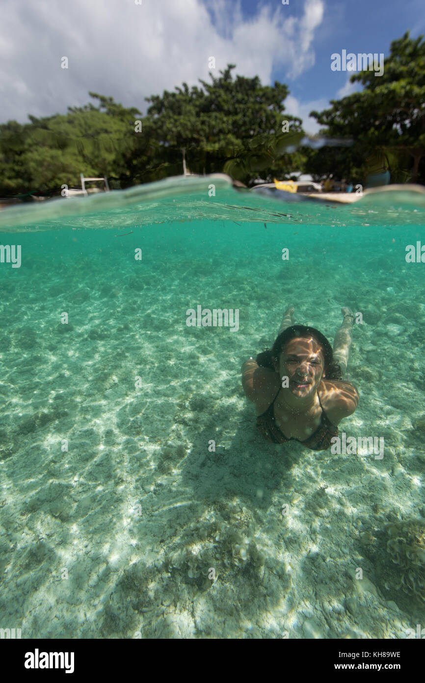 Girl diving on the beach Stock Photo - Alamy