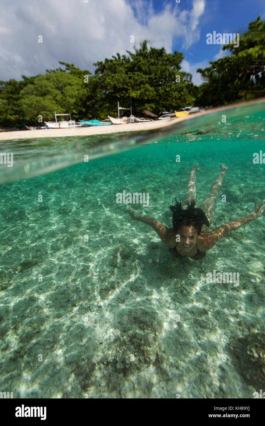 Girl diving on the beach Stock Photo - Alamy