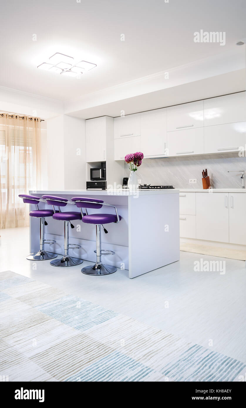 white dining table in modern kitchen Stock Photo - Alamy