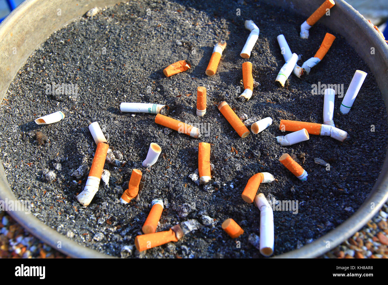 Cigarette ends in an ashtray Stock Photo - Alamy