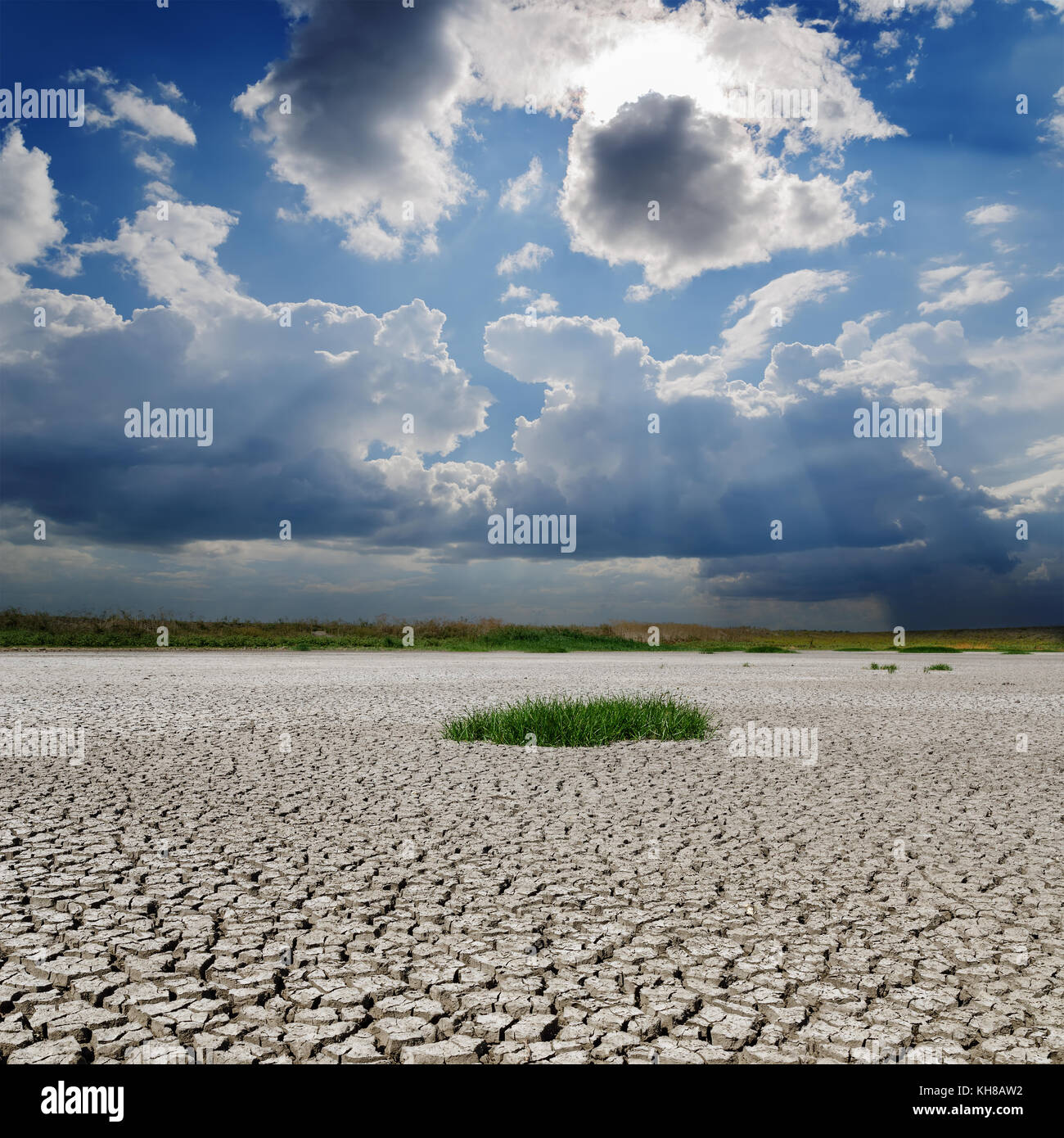 drought earth under rainy clouds Stock Photo - Alamy