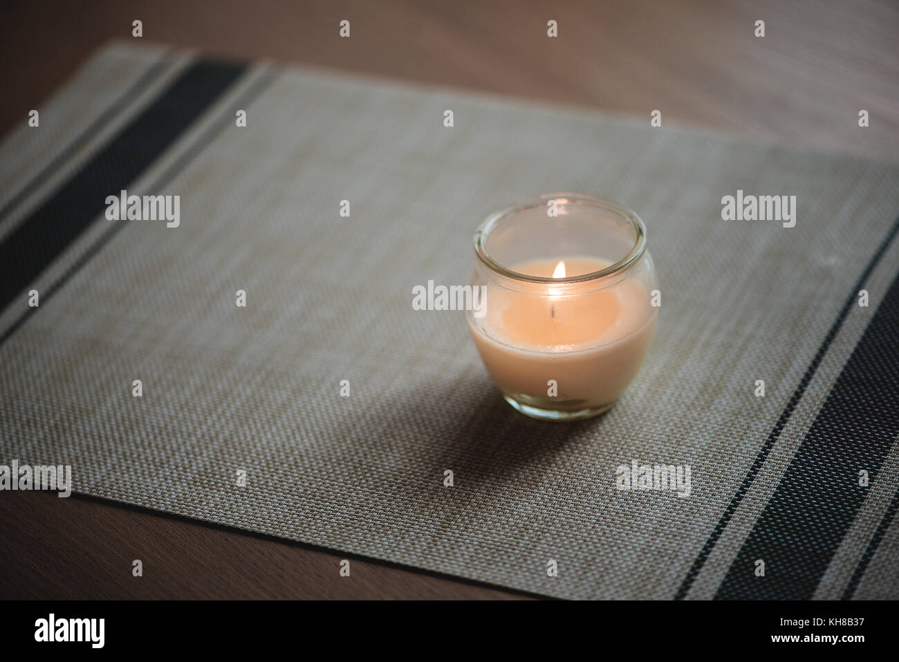 One candle on the table Stock Photo - Alamy