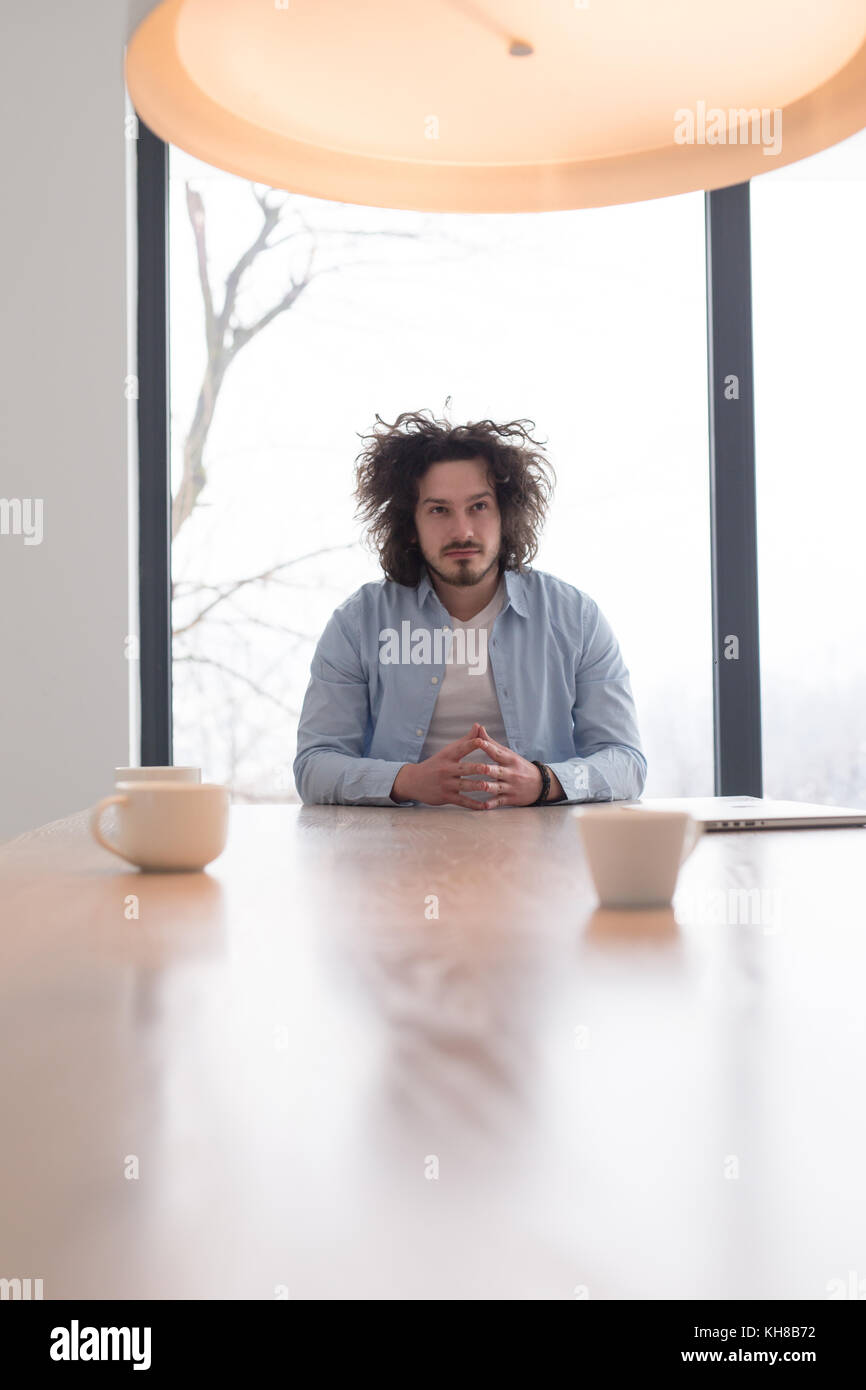 Portrait of a young handsome man enjoying free time at home Stock Photo ...