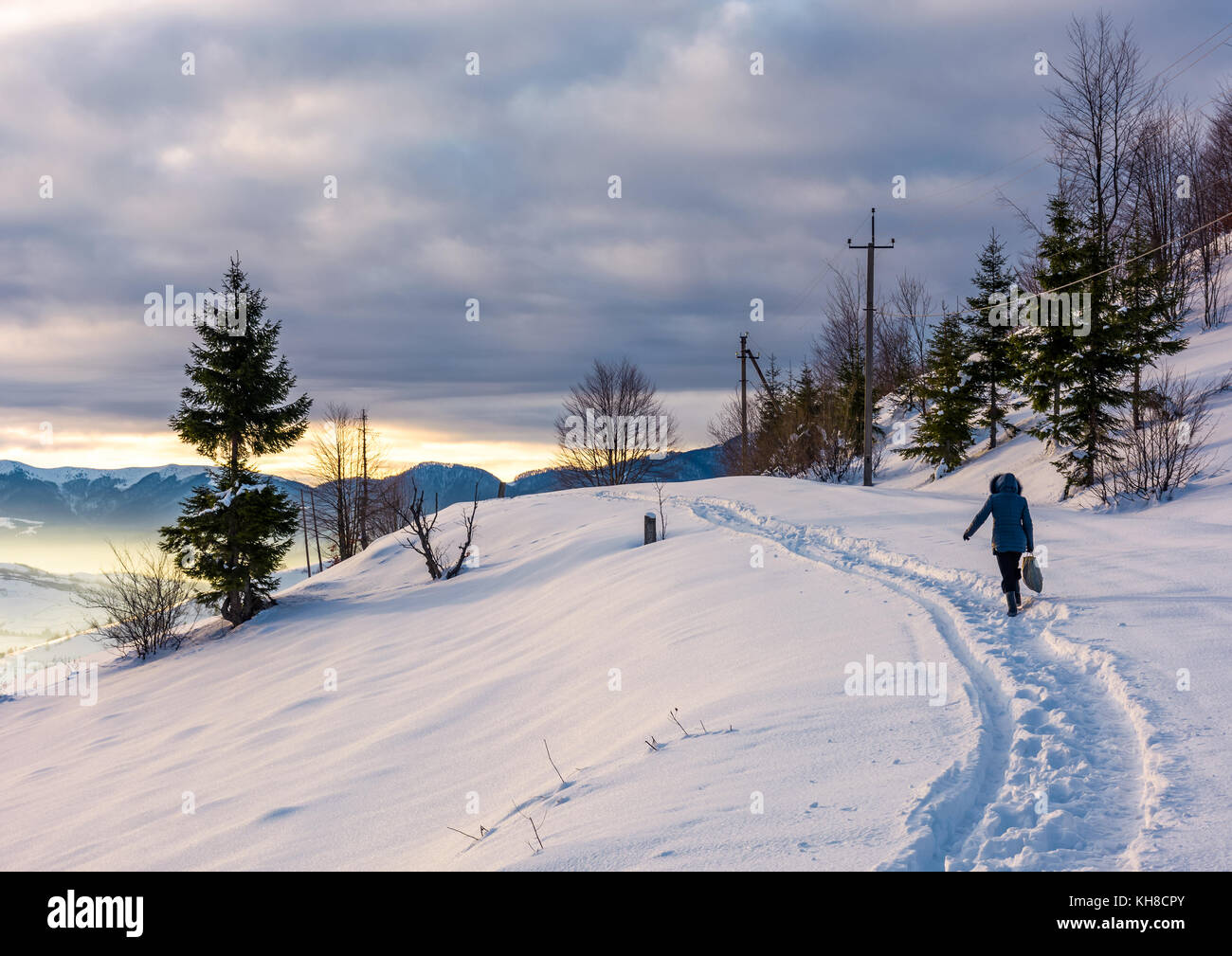 person go through snowy hillside. beautiful scenery of mountainous ...