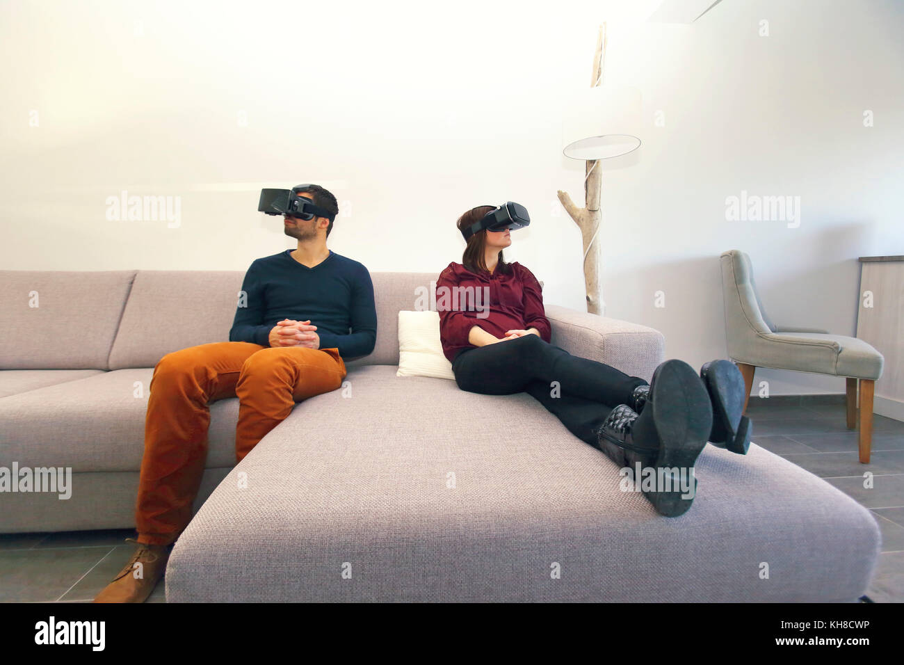 Young couple at home using virtual mask Stock Photo - Alamy