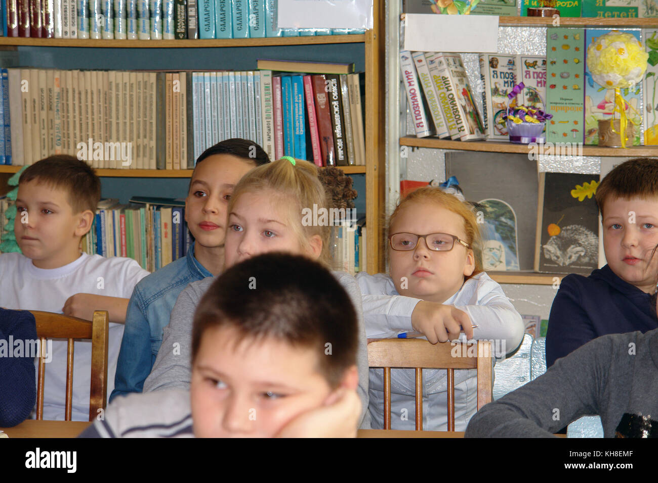 Schoolchildren in classroom at lesson Stock Photo - Alamy