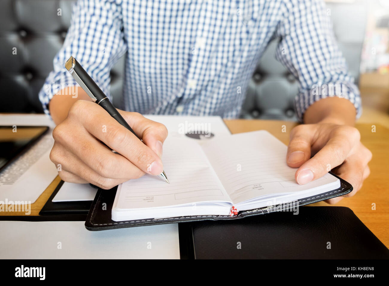 business men working on wooden desk(table) with notebook computer paper ...