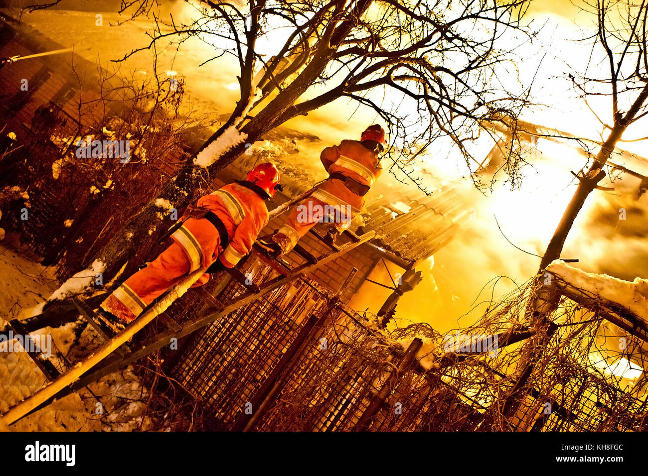 Fighting with the fire at night Stock Photo - Alamy