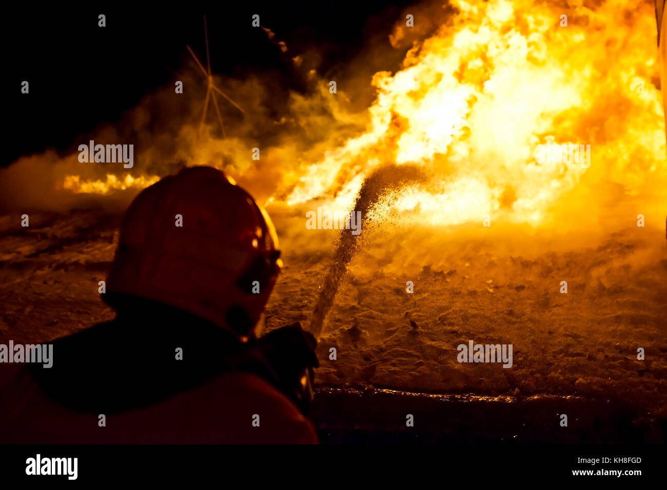 Fighting with the fire at night Stock Photo - Alamy