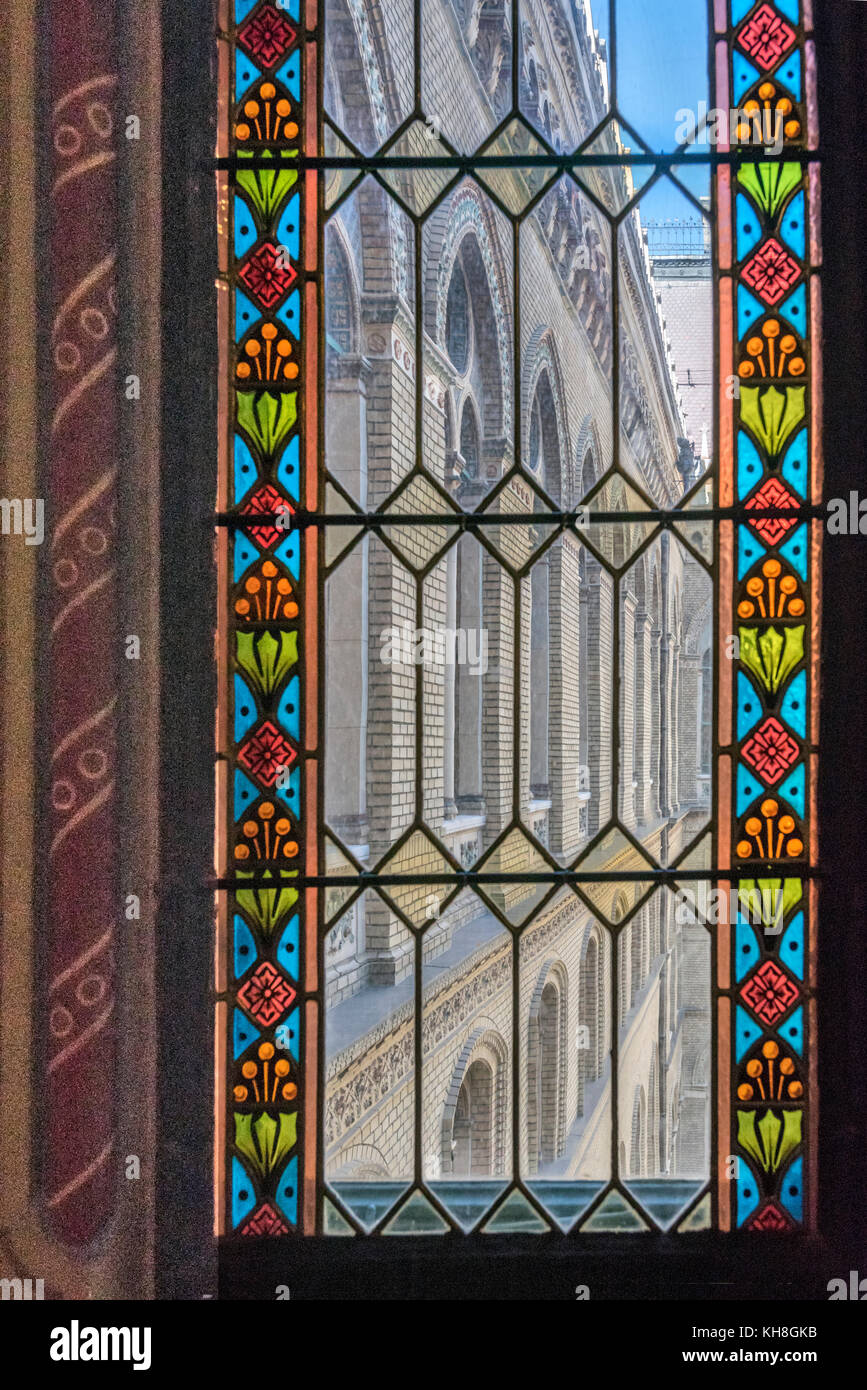 Parliament windows and inner court seen through a stained glass window ...