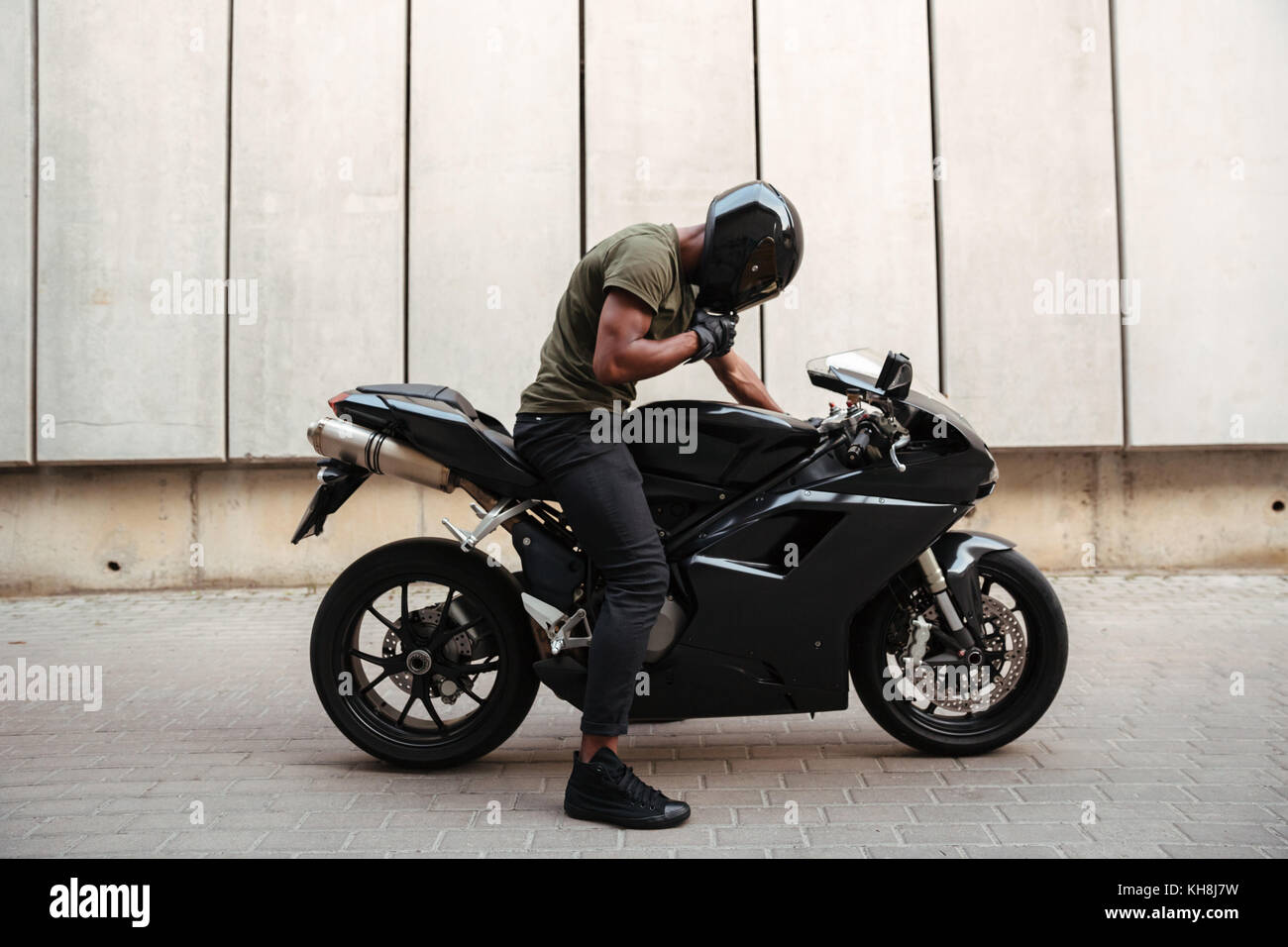 Taking off helmet hi-res stock photography and images - Alamy